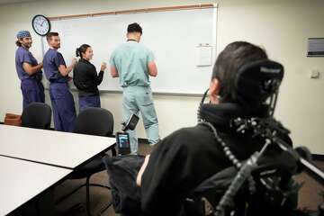 Paralyzed Houston spinal surgeon Dr. Rex Marco returns to UTHealth