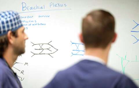 Paralyzed Houston spinal surgeon Dr. Rex Marco returns to UTHealth