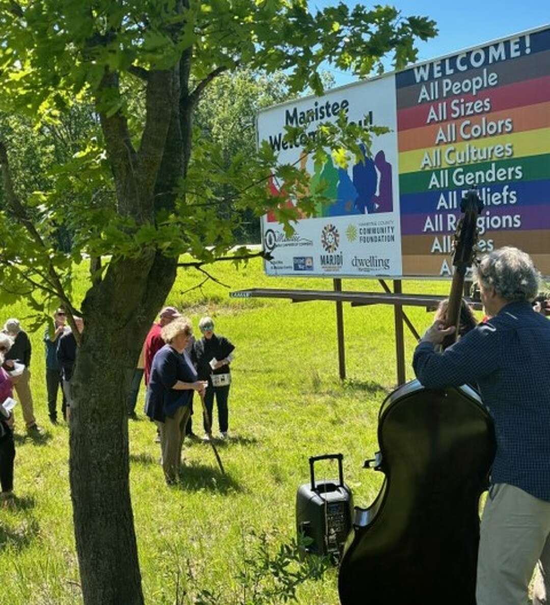 Manistee community gathers for blessing of billboard event
