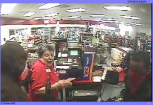 VIDEO: Two held at gunpoint in store robbery