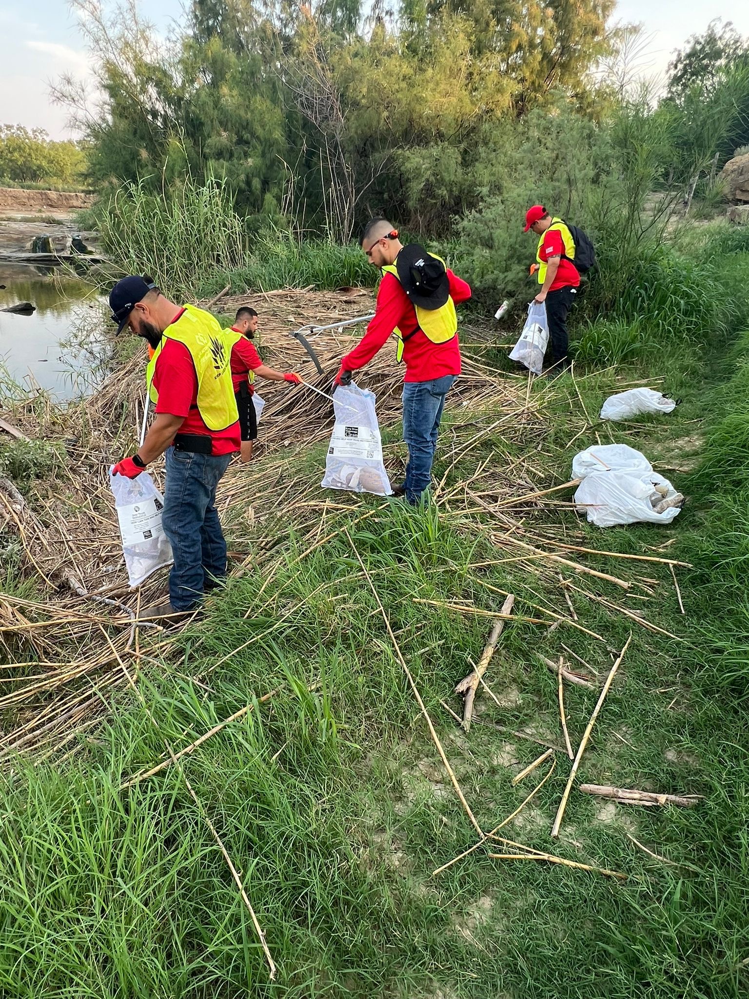 Volunteer for Laredo Zacate Creek cleanup event at Seven Flags Park