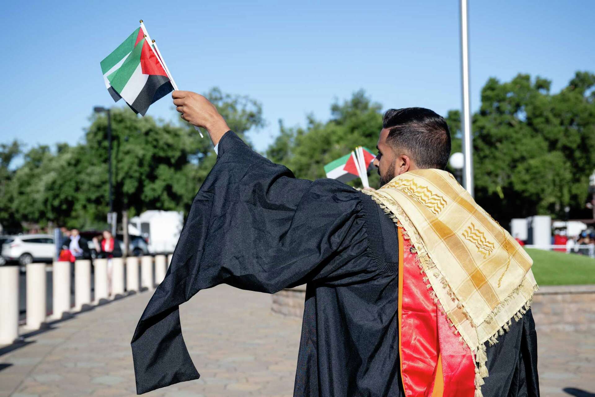 Stanford commencement: Hundreds of graduates walk out to join protest