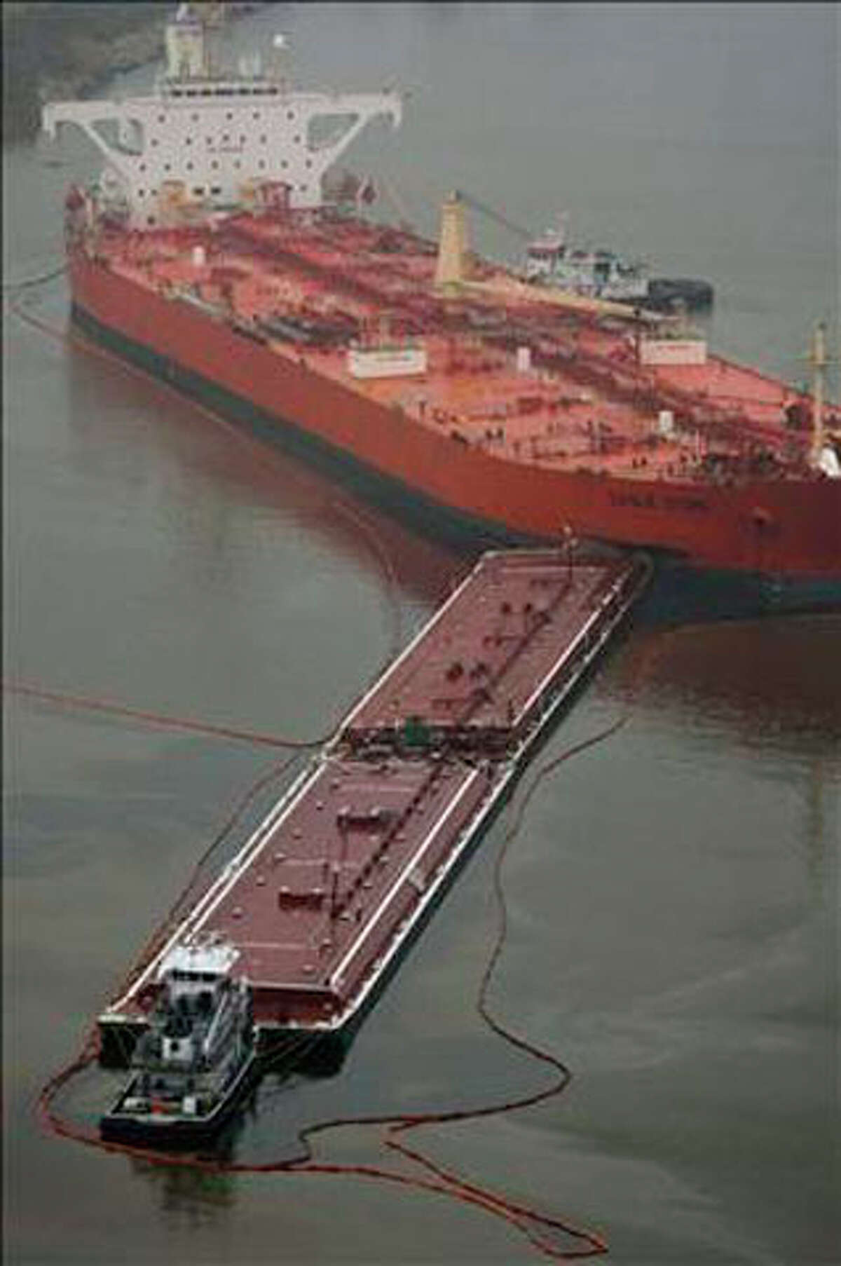 Tanker, Barge collision closes waterway, spills oil