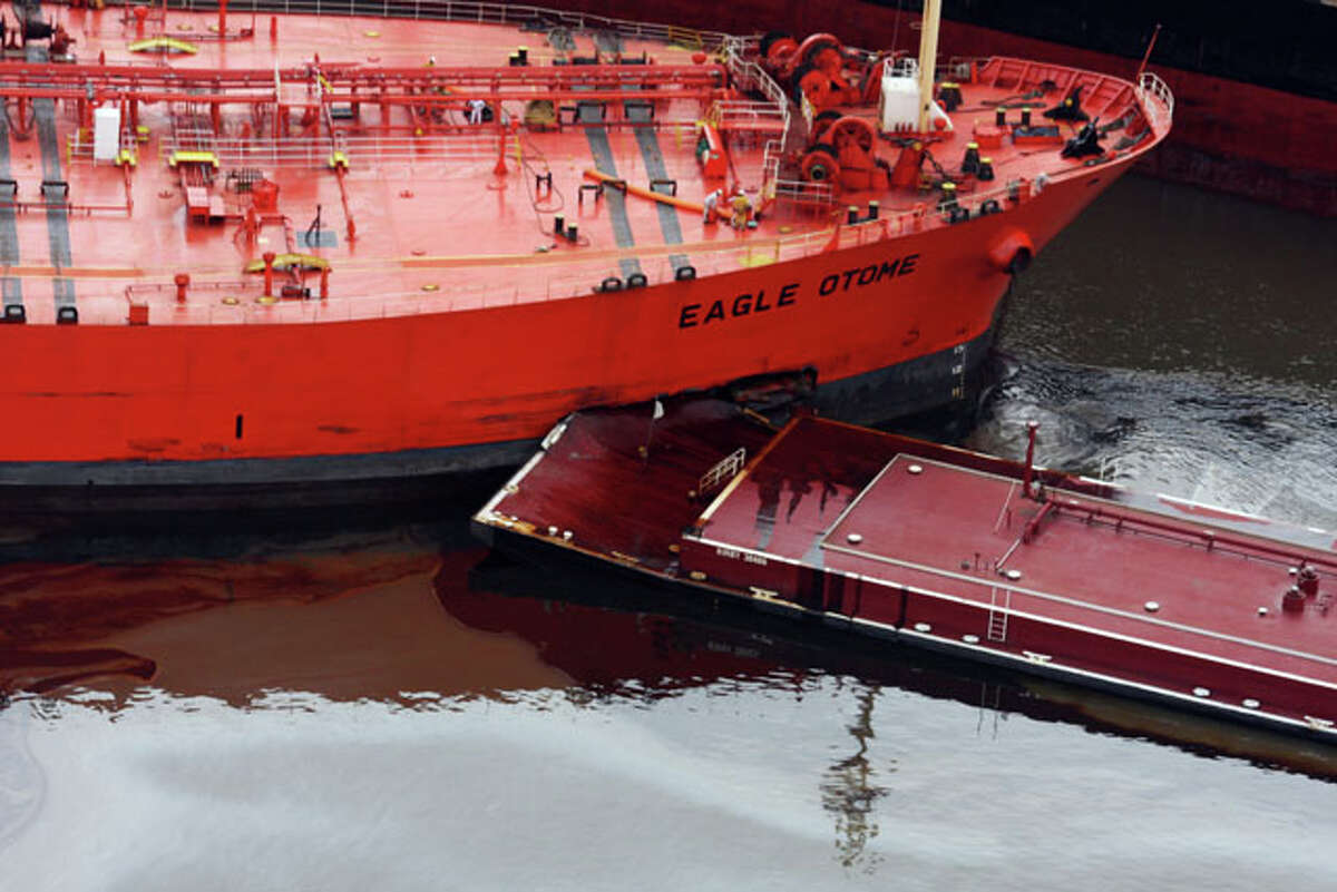 Tanker, Barge collision closes waterway, spills oil