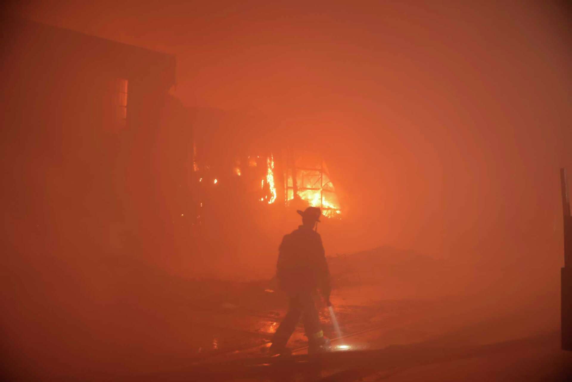 70 firefighters battle massive fire in West Oakland warehouse