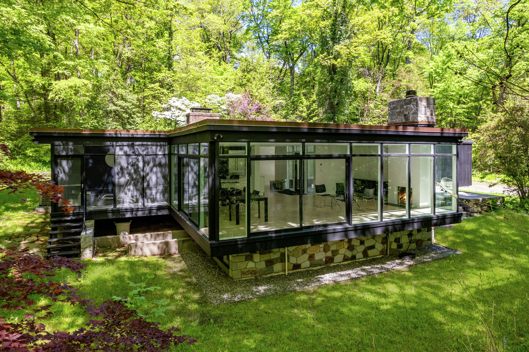 Midcentury modern glass house in Burlington listed for $1.4 million