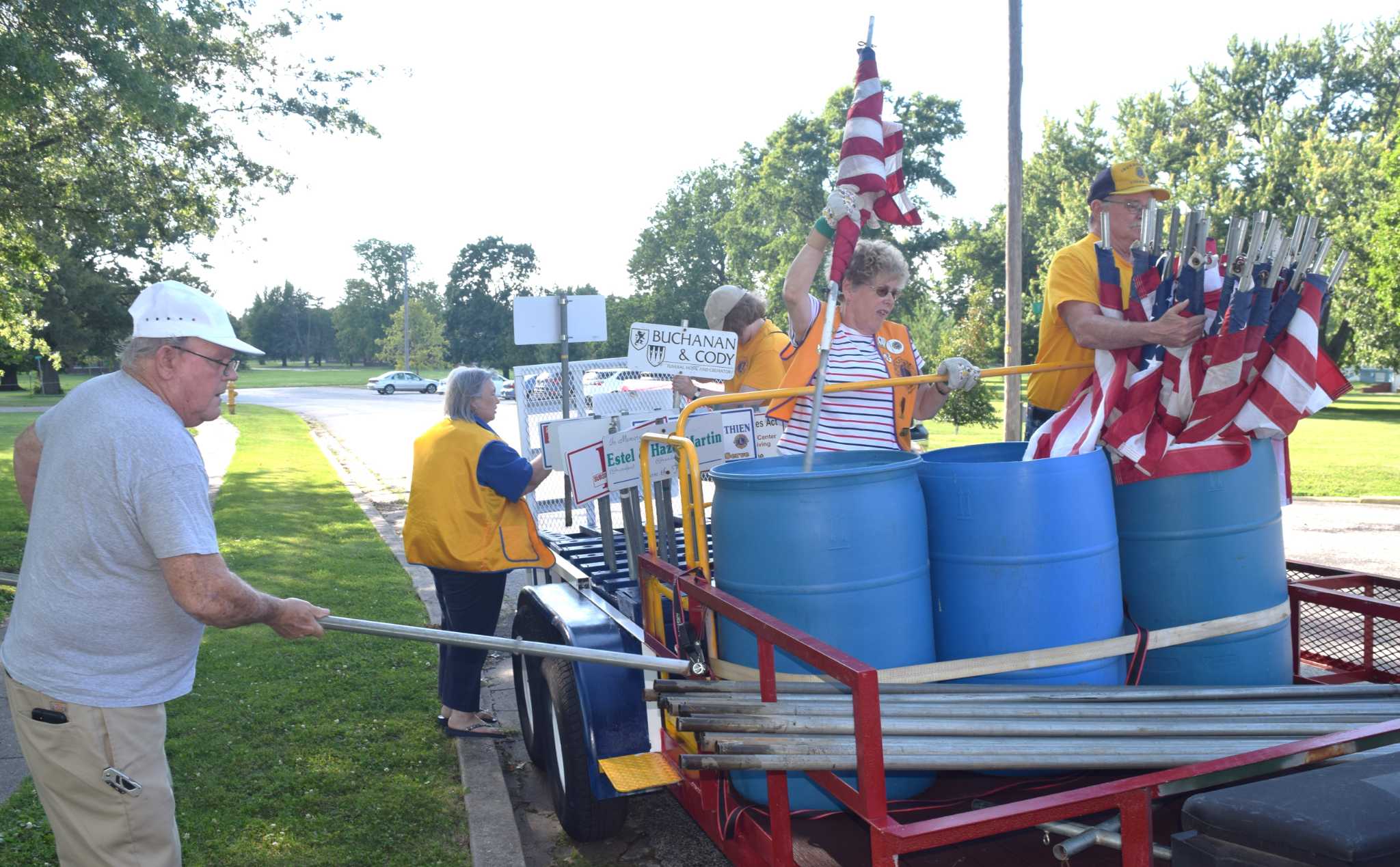 Jacksonville Lions Club members retire the colors in Community Park