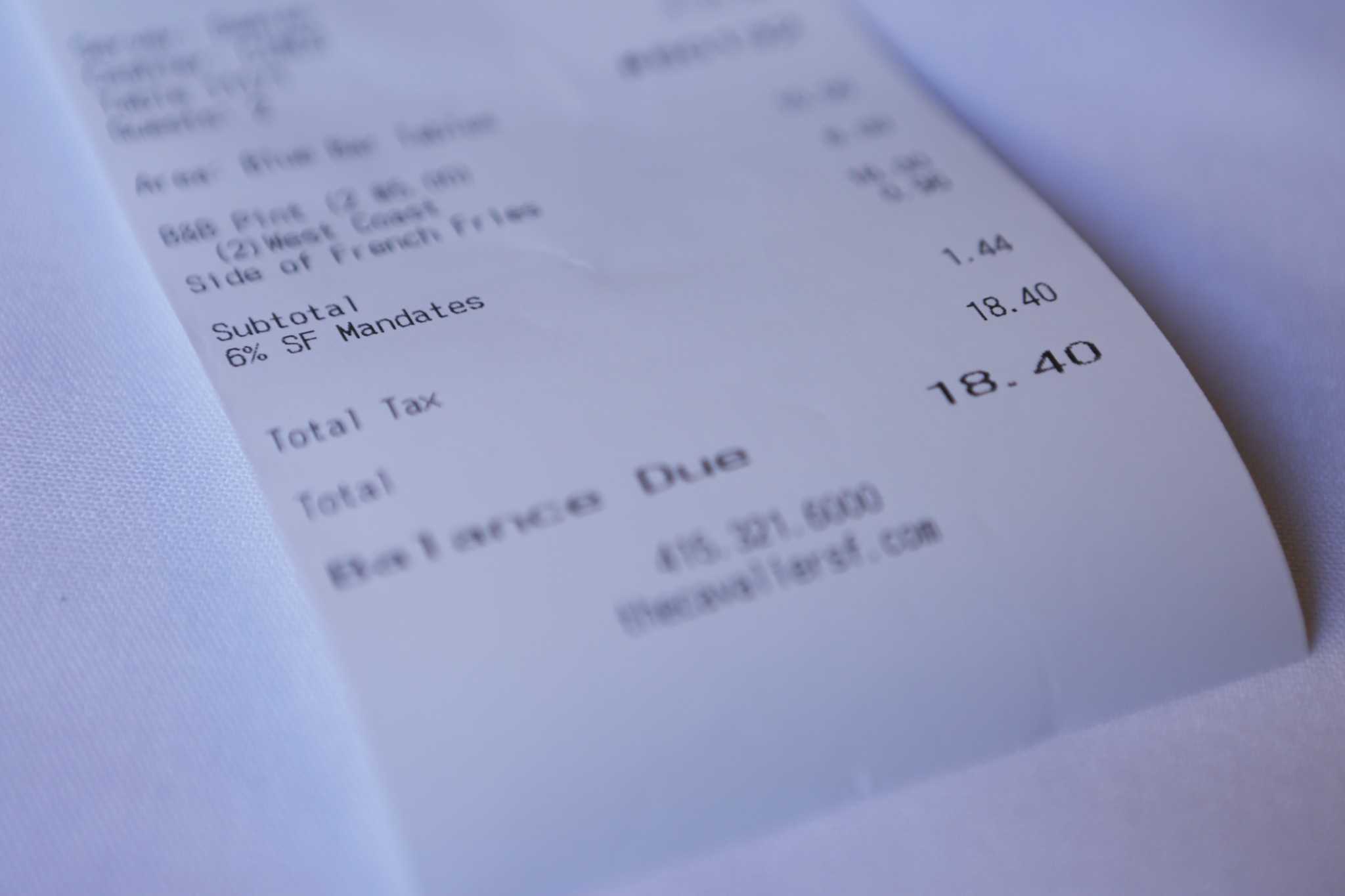 What more than 100 S.F. restaurants charge in extra fees