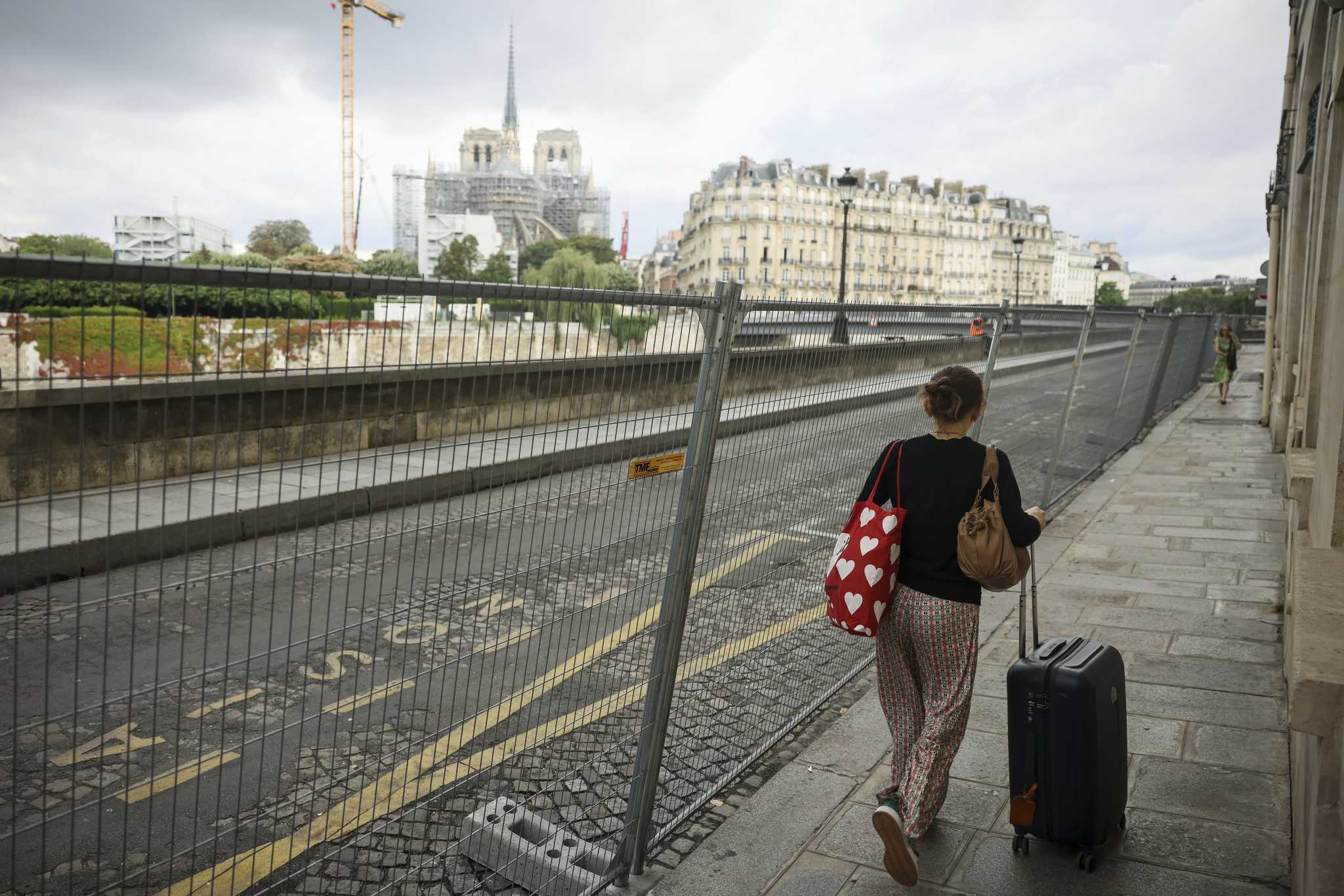 Paris remains beautiful, but will be seen in Olympics through fences