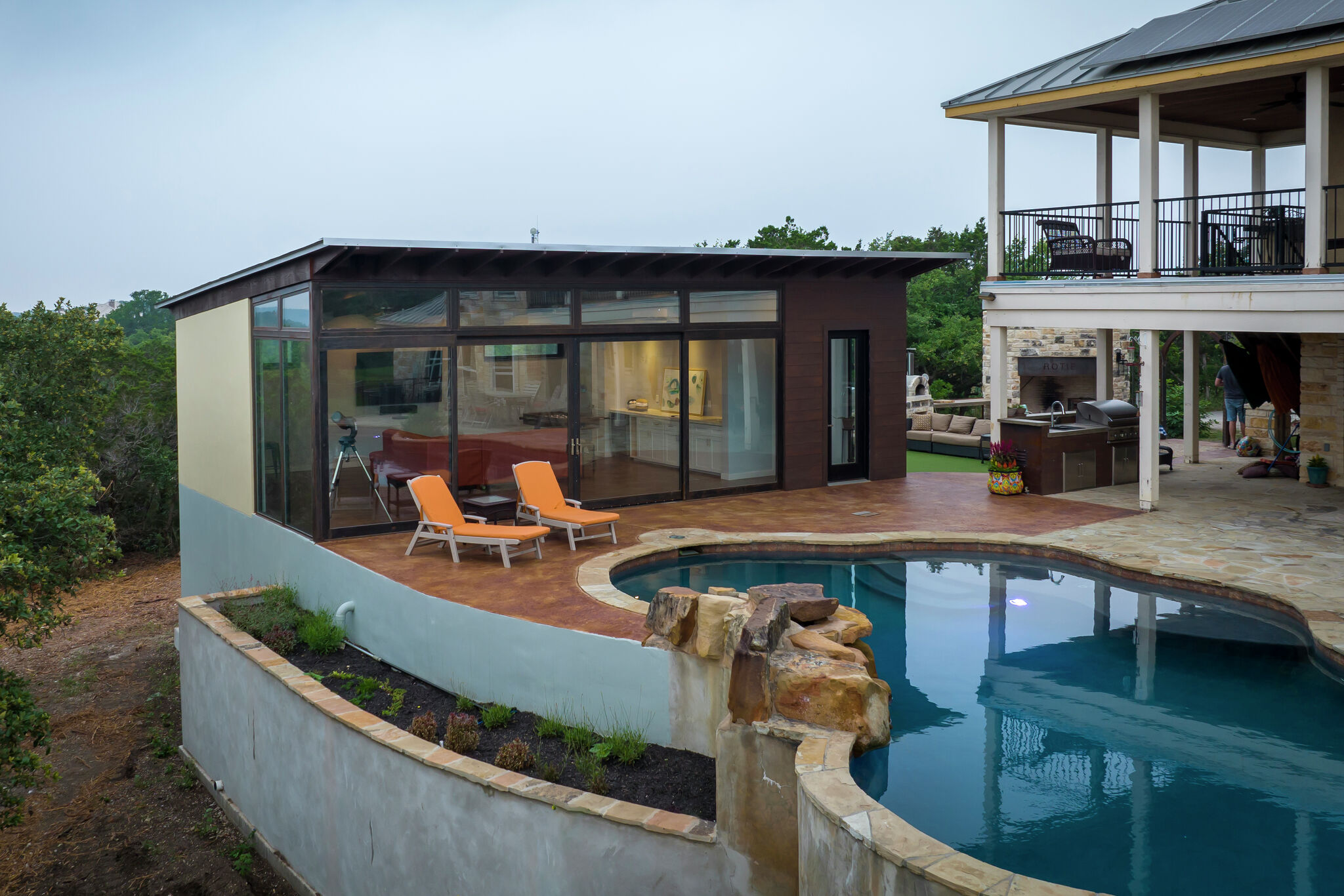 Helotes backyard levels up with modern pool pavilion