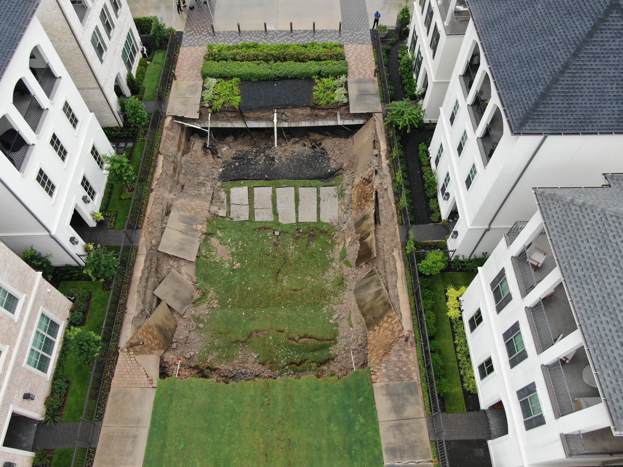 Houston Fire responds to ground collapse in gated community