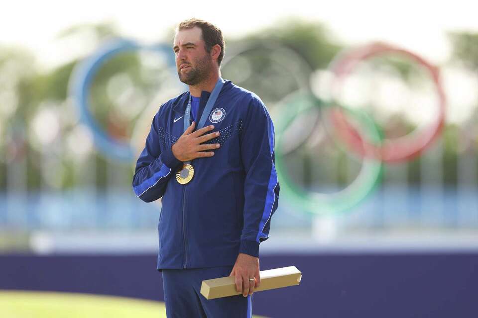 Olympic golf: Scottie Scheffler surges out of crowd to win gold medal