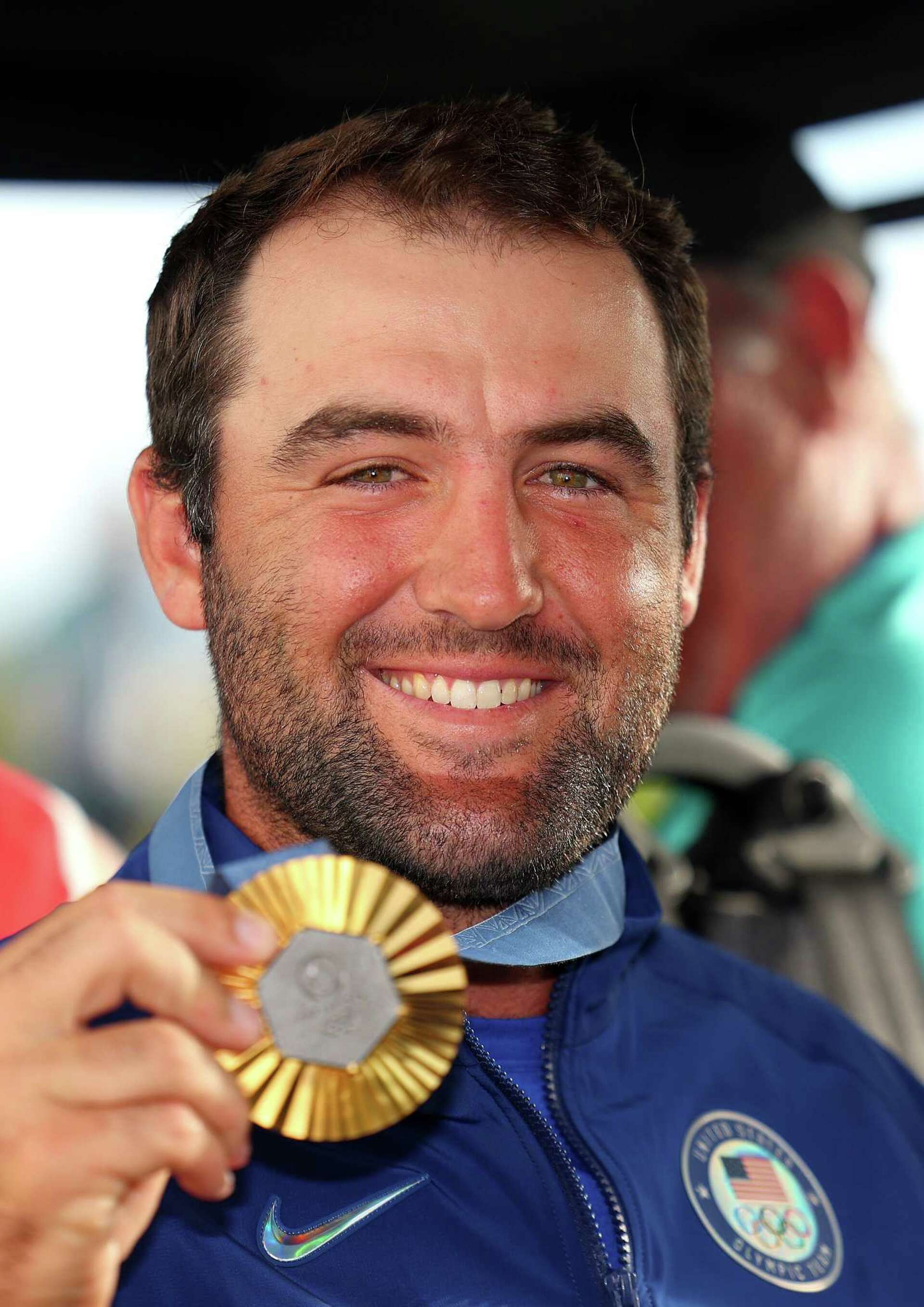 Olympic golf: Scottie Scheffler surges out of crowd to win gold medal