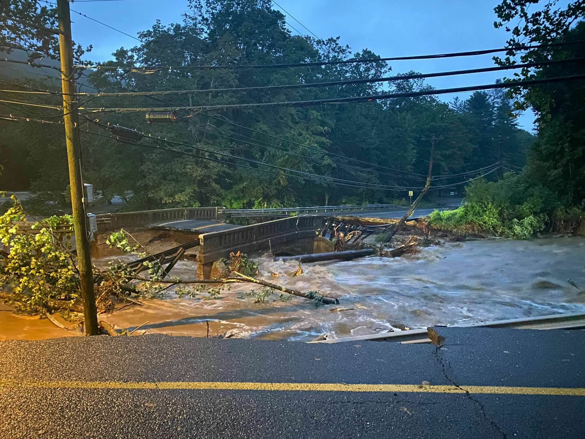 Flash flooding in CT causes road washouts, evacuations, missing people