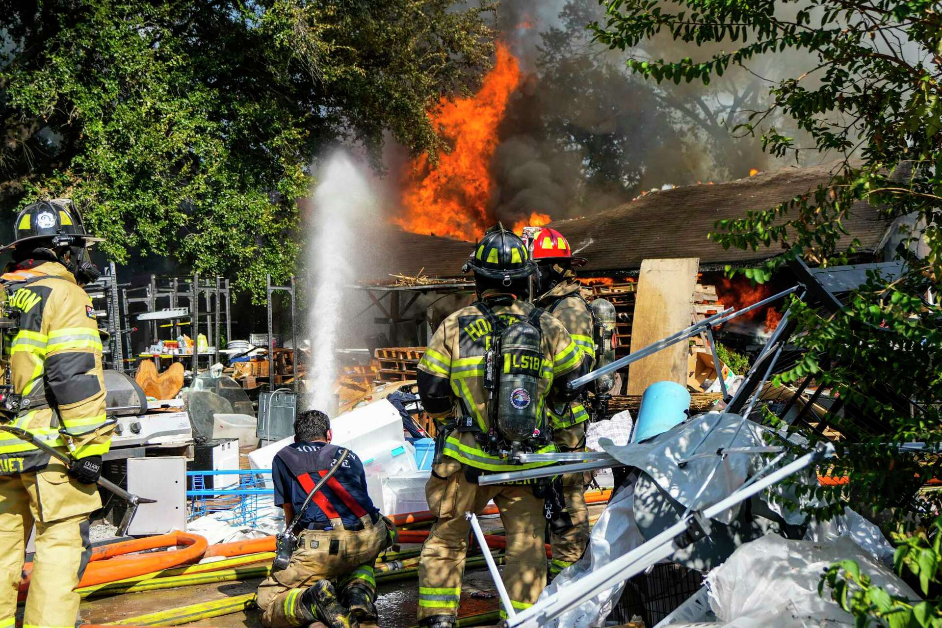 Firefighters working to contain large house fire in southwest Houston