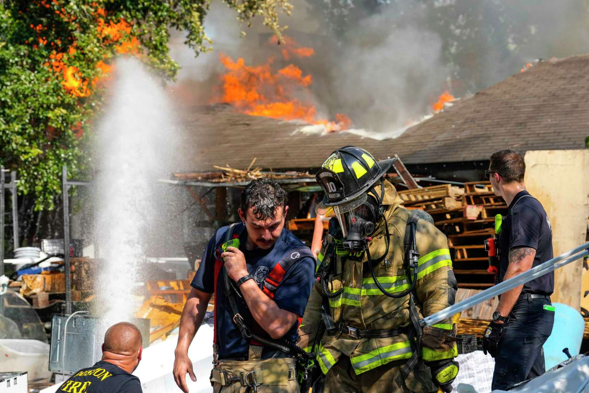Firefighters working to contain large house fire in southwest Houston