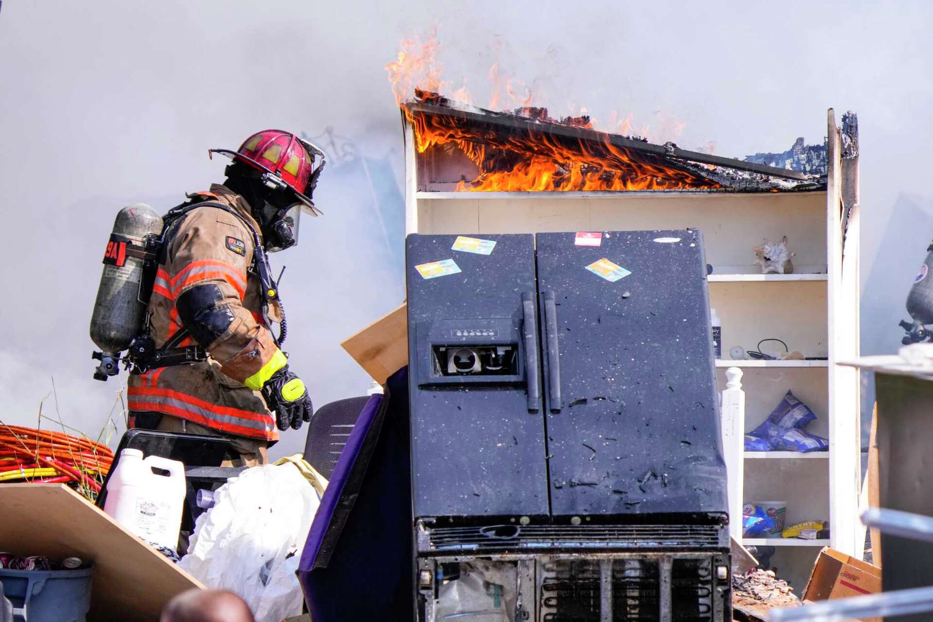 Firefighters working to contain large house fire in southwest Houston