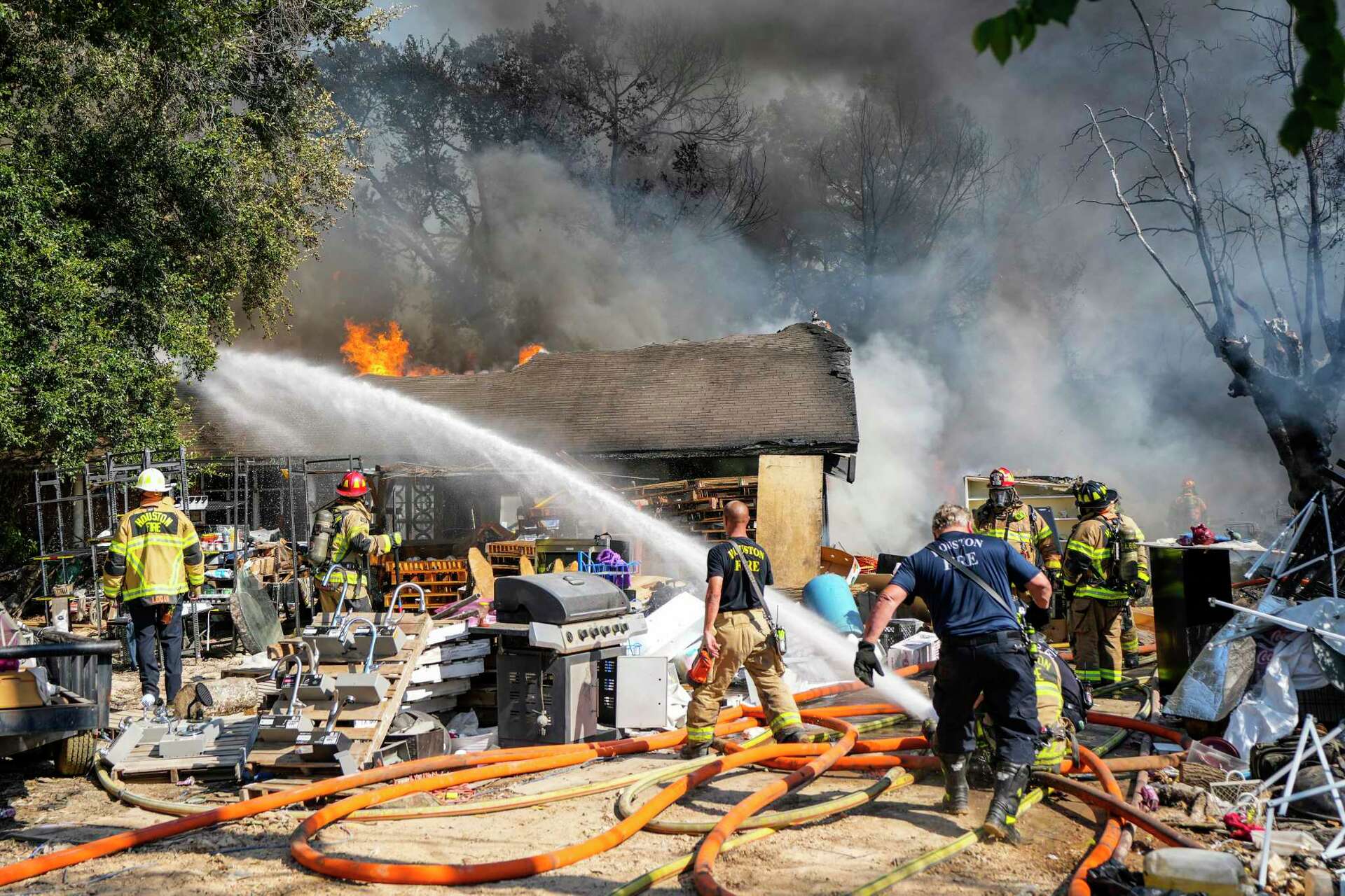 Firefighters working to contain large house fire in southwest Houston
