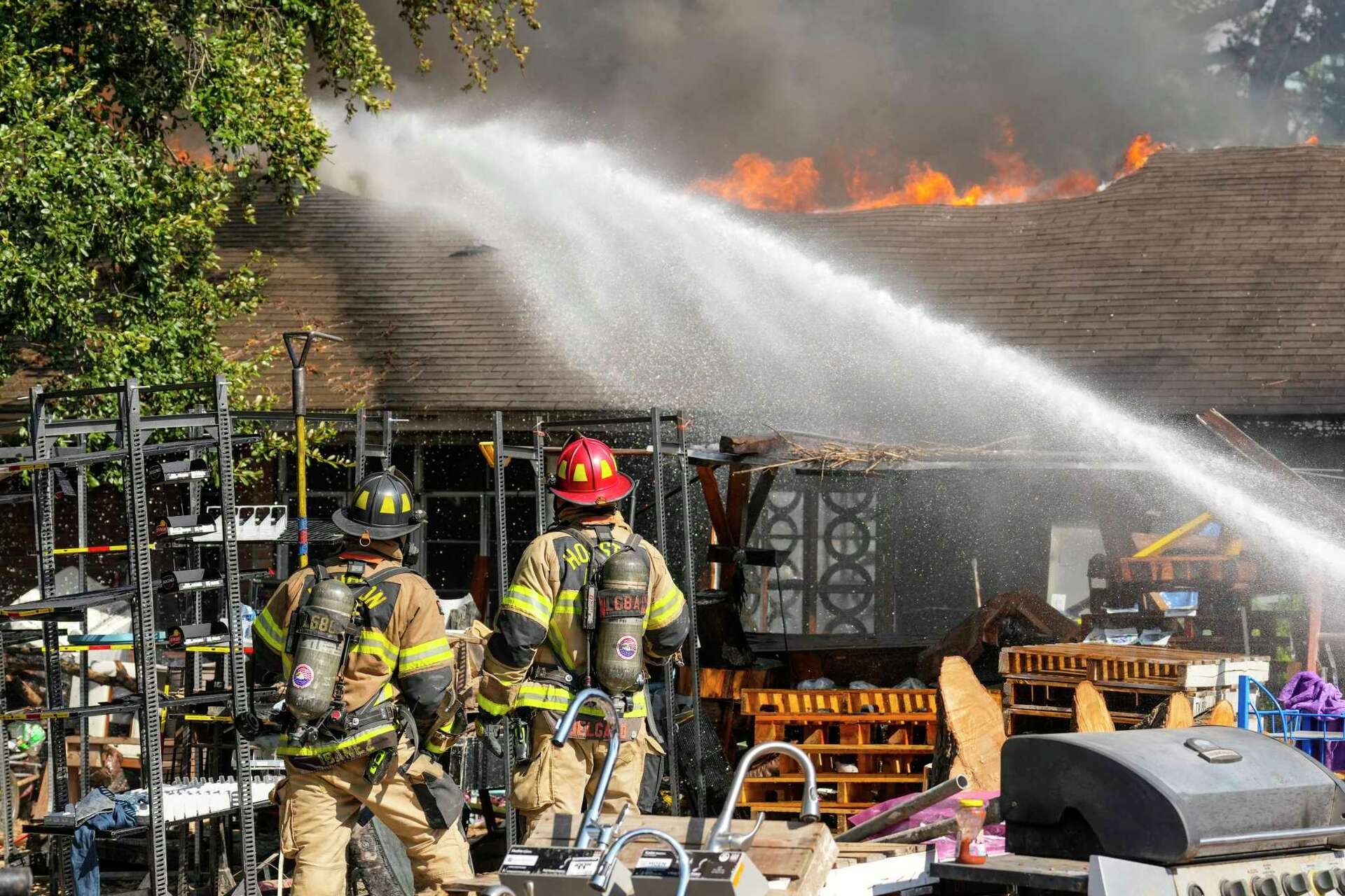 Firefighters working to contain large house fire in southwest Houston