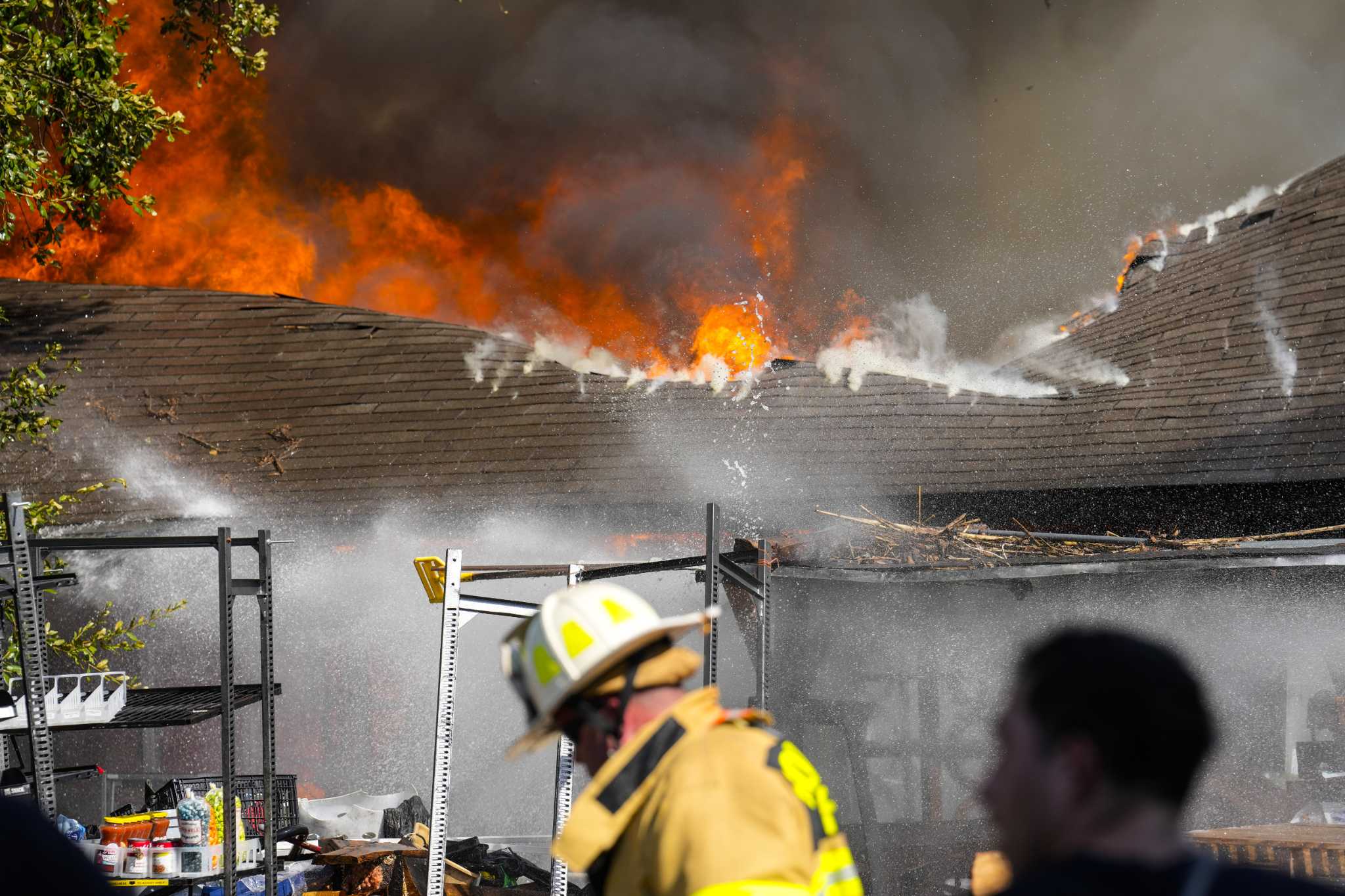 Firefighters working to contain large house fire in southwest Houston