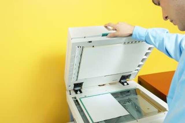 How to Empty Punch Waste on a Sharp Copier
