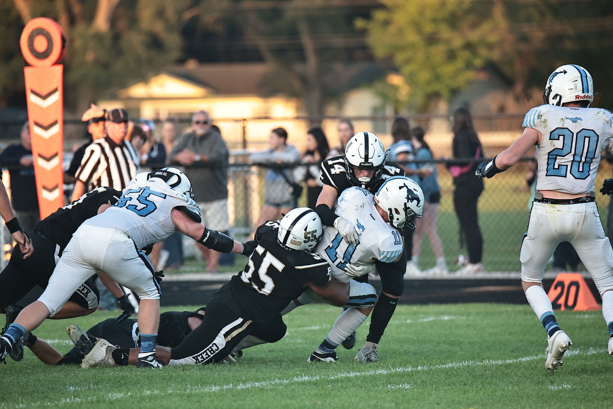 Lancers lose, Falcons cruise in football