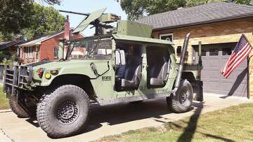 Illinois homeowner parks Humvee with replica machine gun in driveway