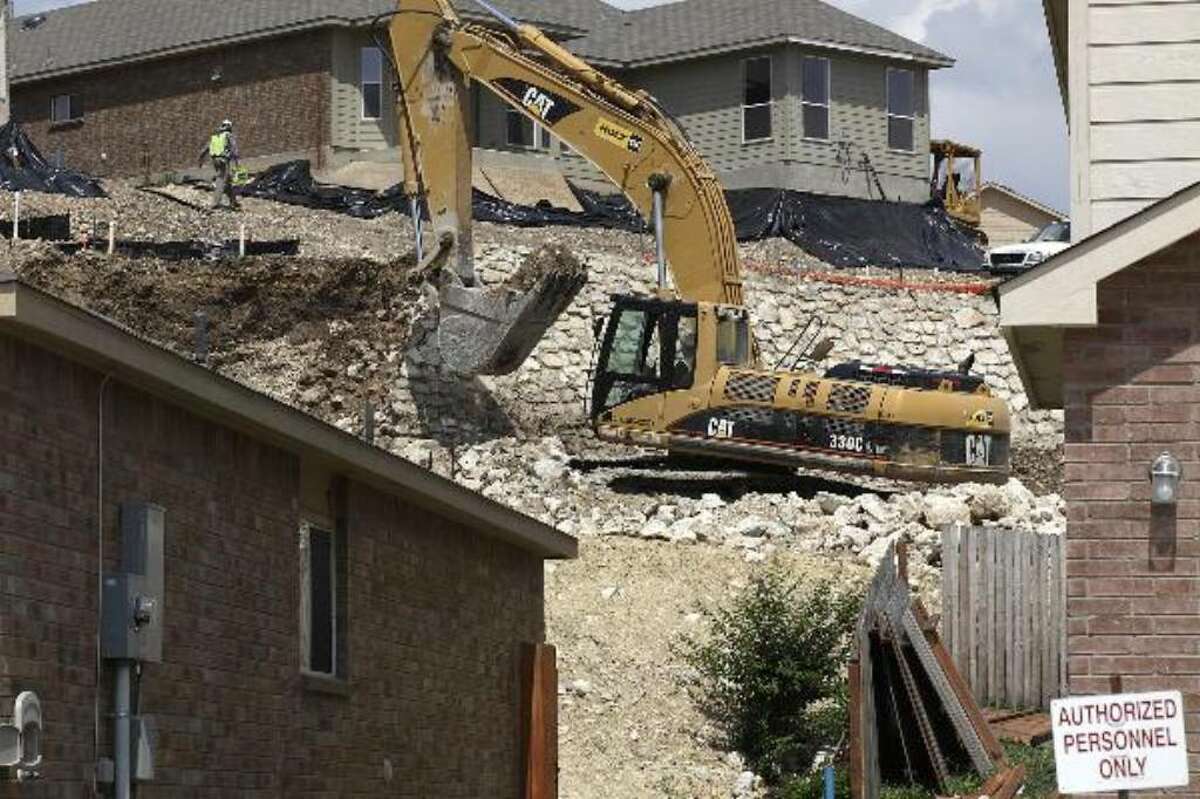 Collapsed retaining wall prompts suit