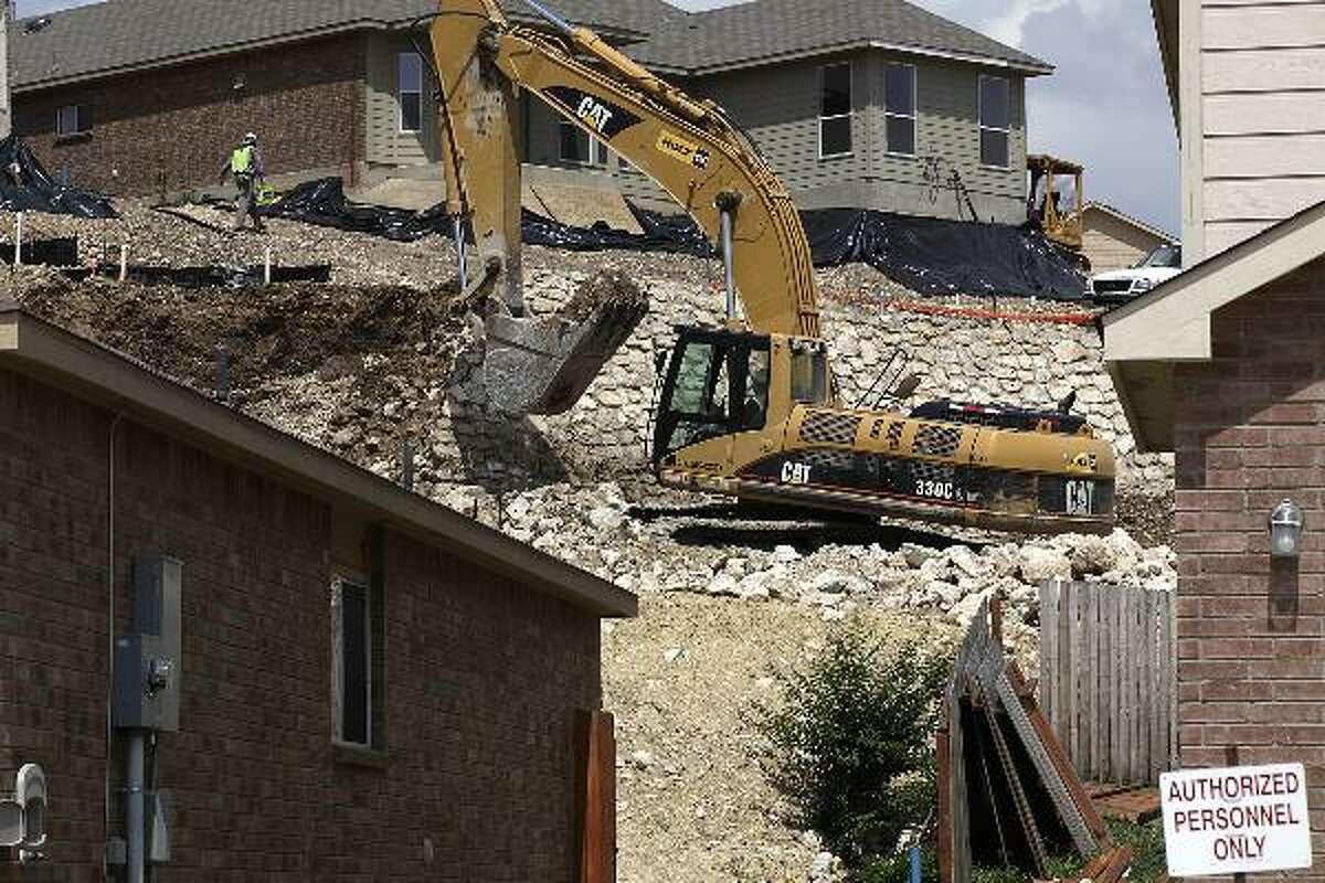 Collapsed retaining wall prompts suit
