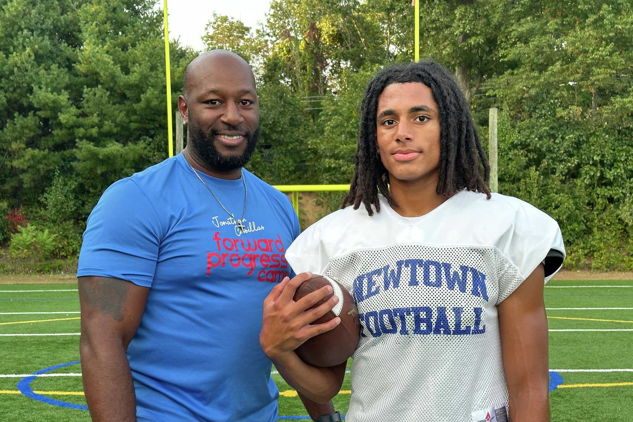 Newtown High football player Jayden Taylor guided by father Marvin