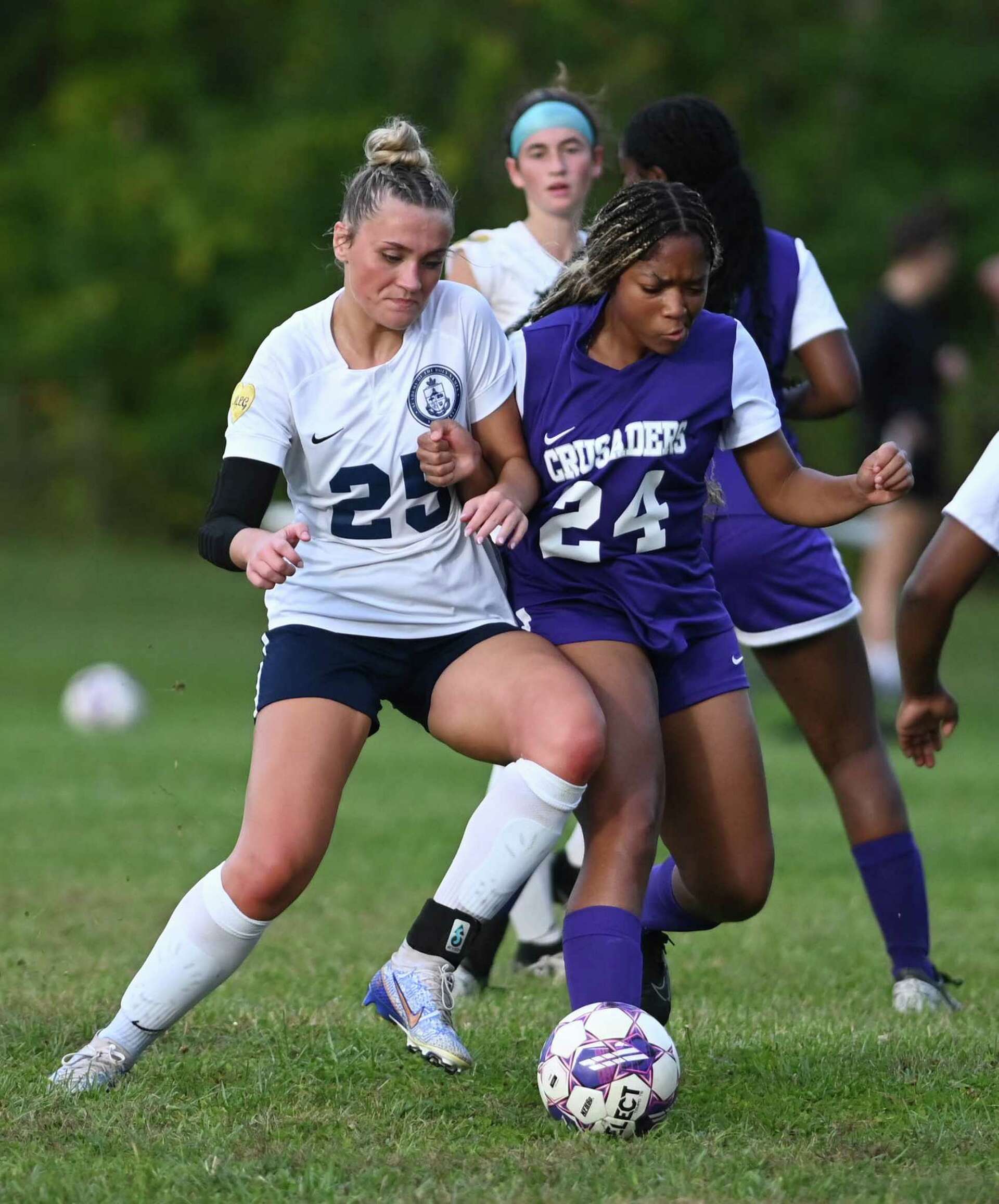 Twin sisters unite on Holy Names soccer team