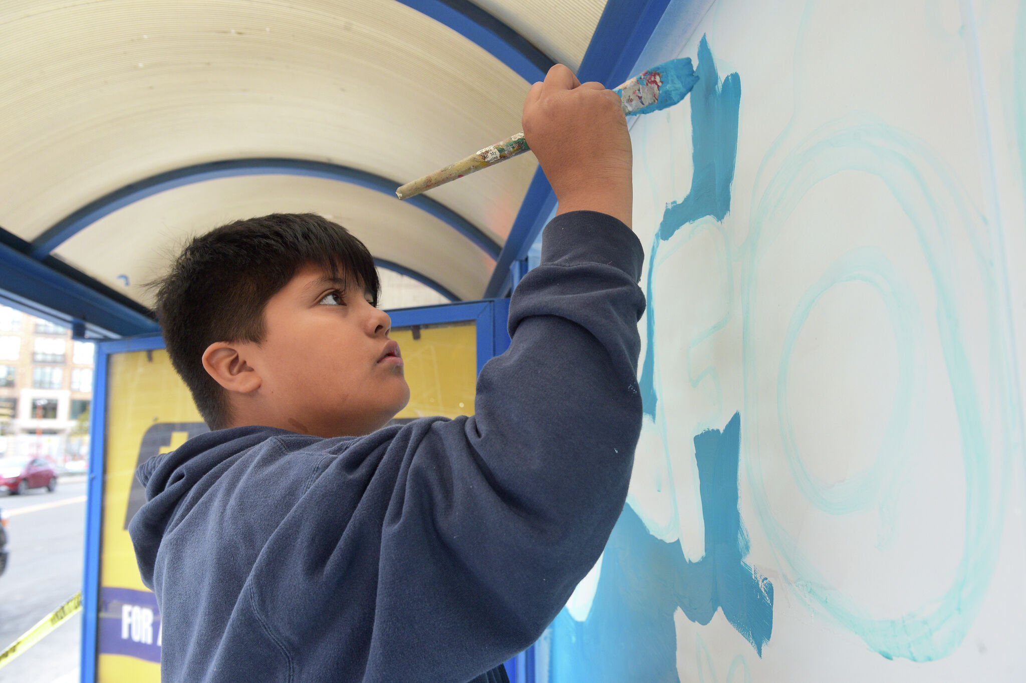 In photos: Norwalk teen artists paint mural 'to beautify' bus shelter