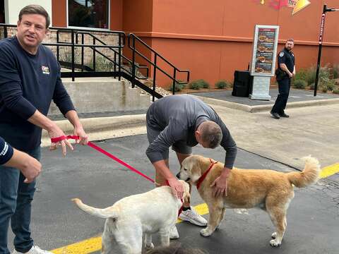 ESPN's Kirk Herbstreit and his dog meet Cane III at Raising Cane's