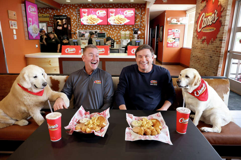 ESPN's Kirk Herbstreit and his dog meet Cane III at Raising Cane's