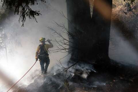 Oakland fire about 70% contained, but high winds keep danger high