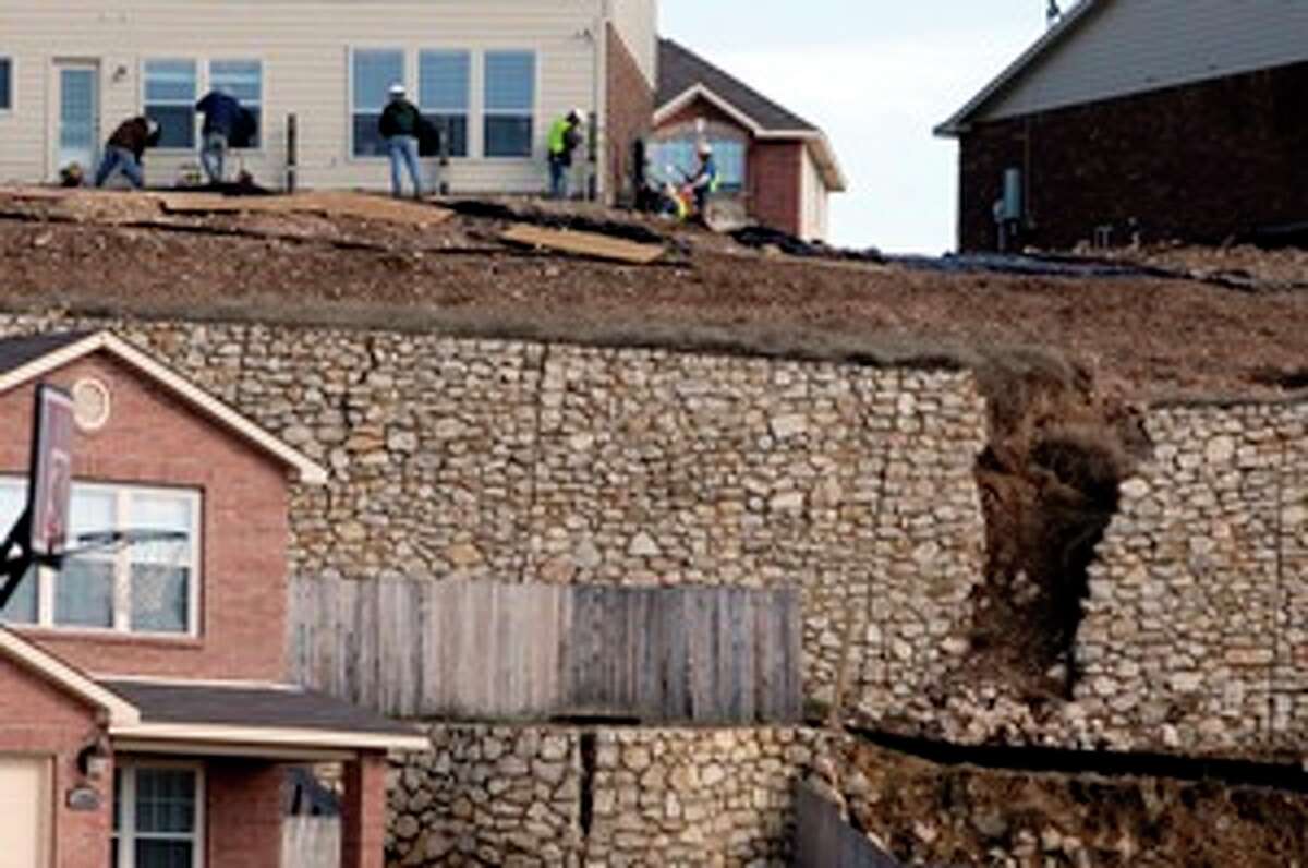 Collapsed retaining wall prompts suit