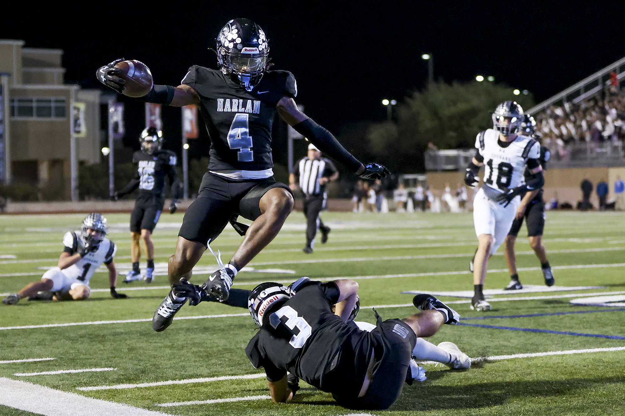 Harlan football takes down Clark in first round of playoffs