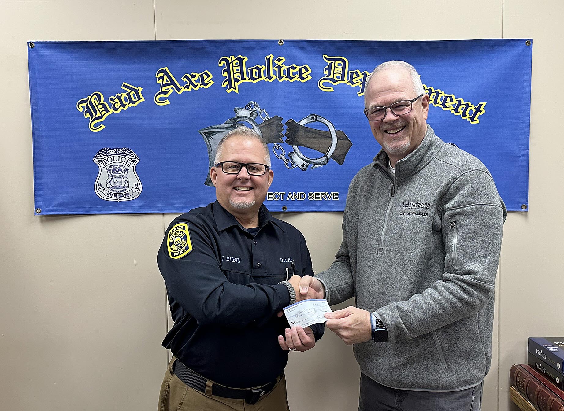 Bad Axe Lions Club gives $1,500 to Shop with a Hero program