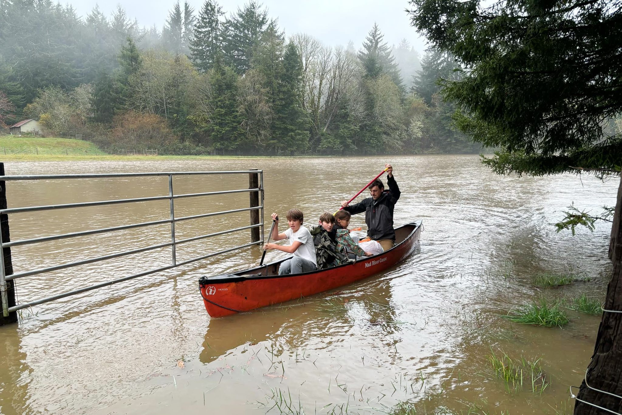 Floods cut off a California neighborhood, so residents opt for canoes