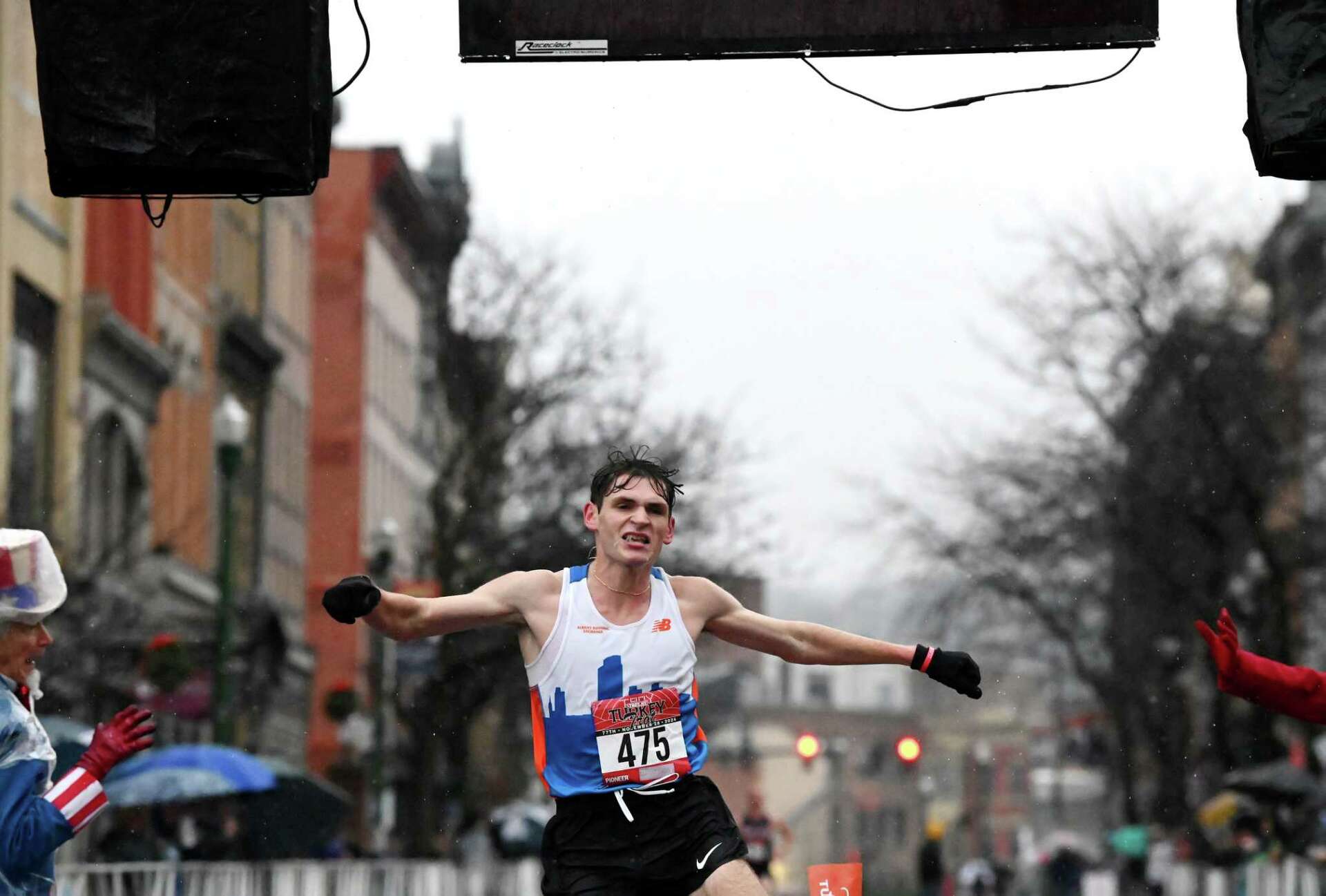 Photos: A wet, cold Troy Turkey Trot