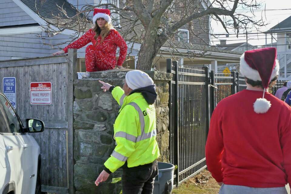 In photos: Thousands crowd beach for Fairfield's SantaCon