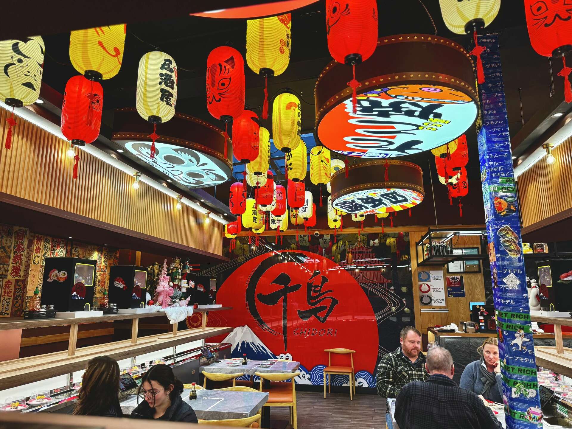 At new revolving sushi spot in Connecticut a robotic train brings food