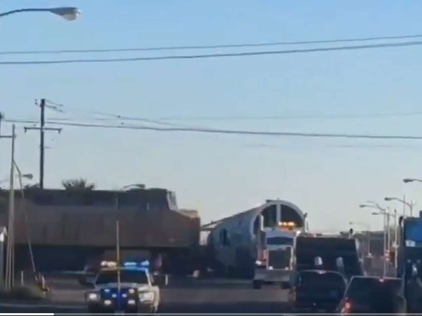 Texas train derails after hitting truck, smashing city building