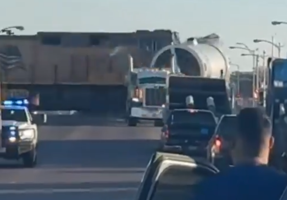 Texas train derails after hitting truck, smashing city building