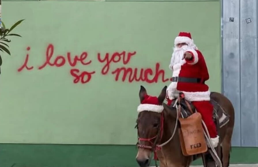 Santa rides horse past Cybertruck in festive Austin moment