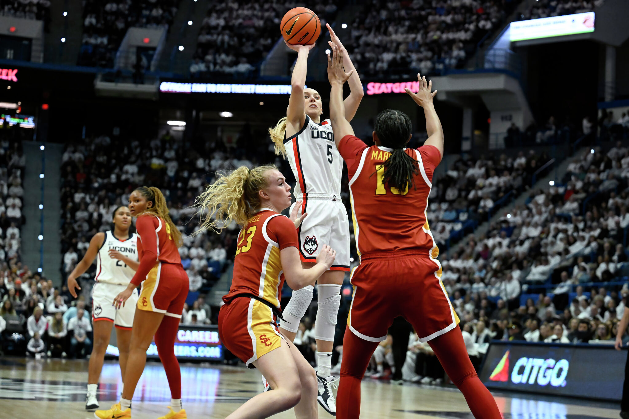 UConn, USC wearing sneakers with slogan from Sue Bird's brand