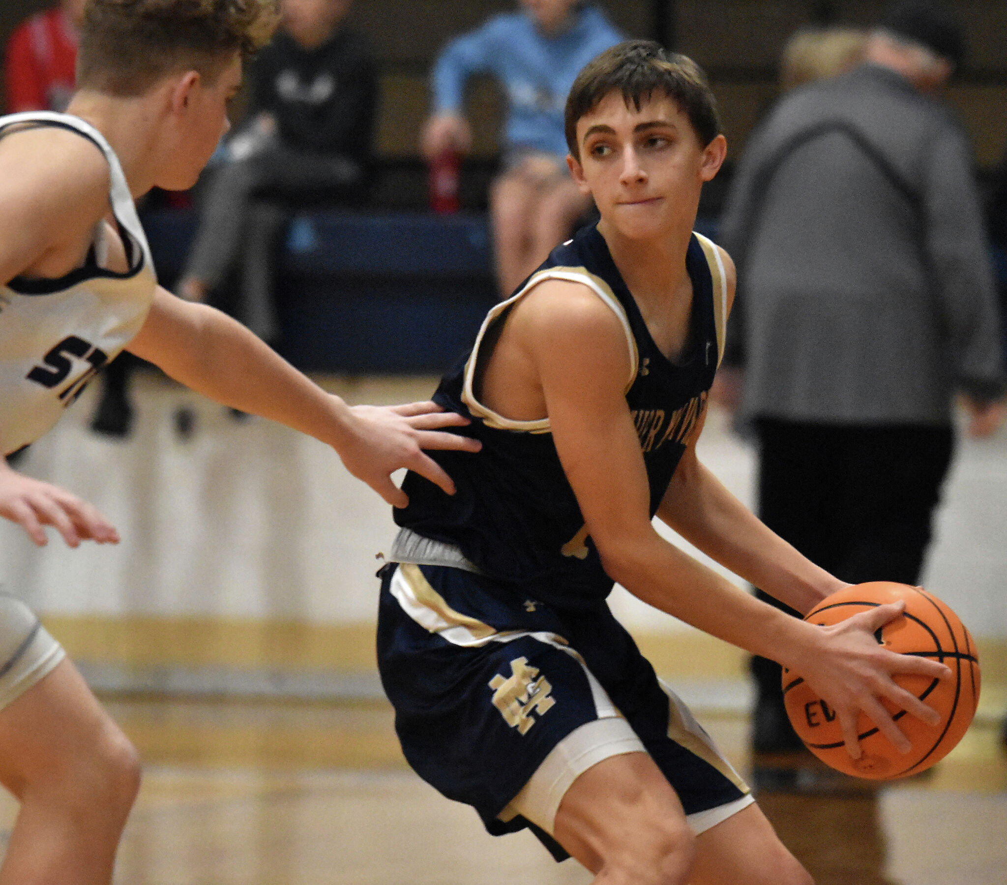 Father McGivney boys win third straight basketball game