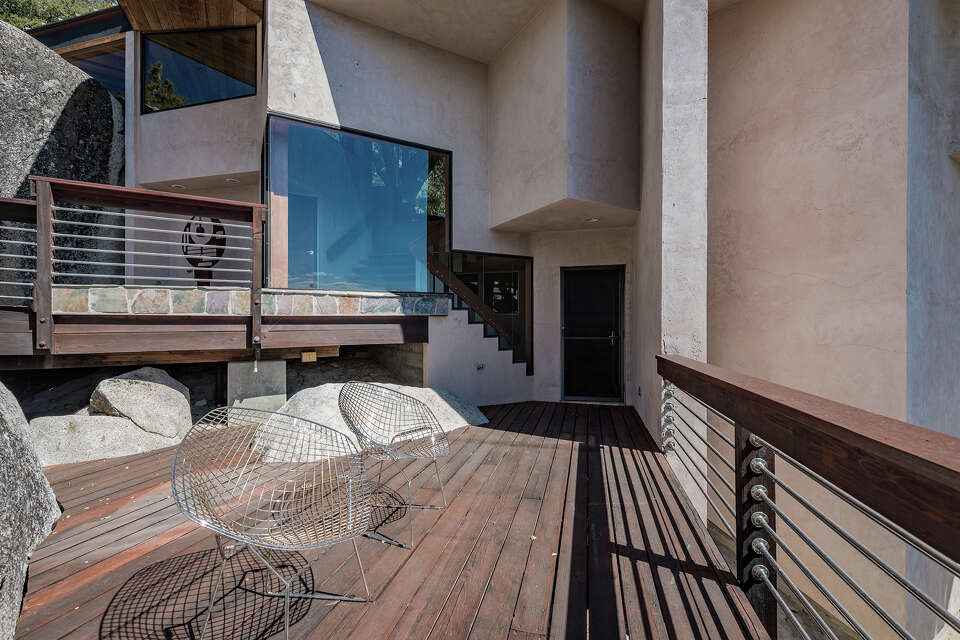 Unique California mountain house has a bedroom filled with boulders