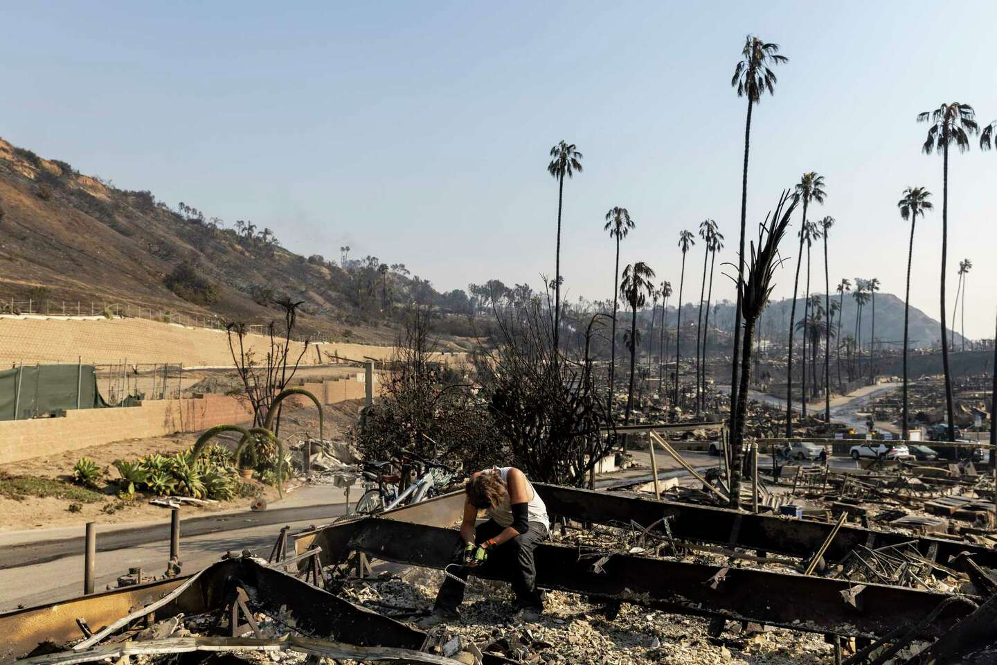 California fires: Death toll rises to 10 as Palisades, Eaton burn