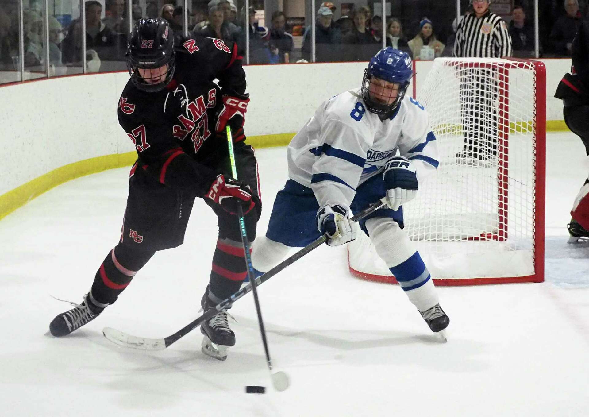 New Canaan boys hockey rallies past Darien behind Rogan Lowe
